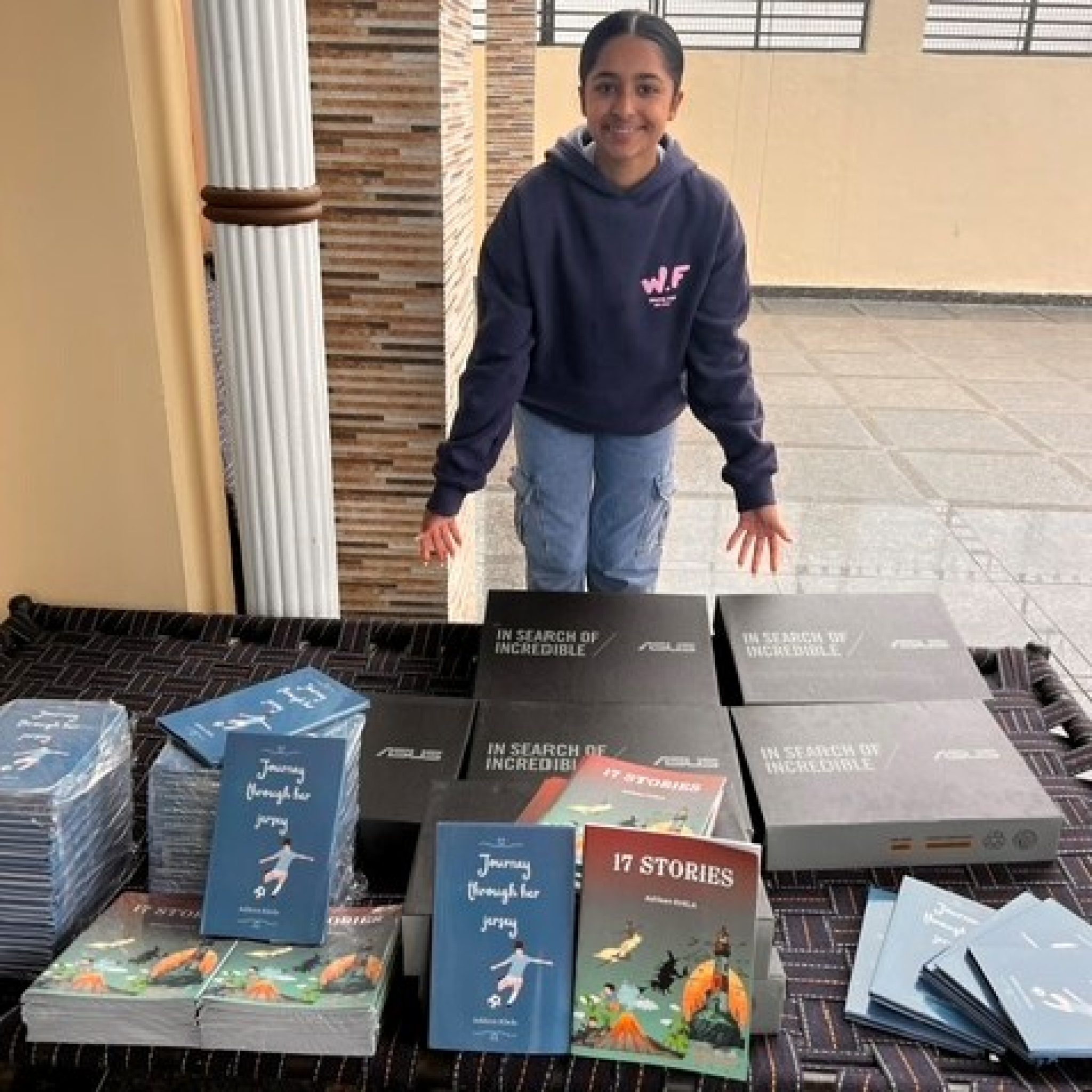 Australia’s youngest female author Ashleen Khela helps the ...